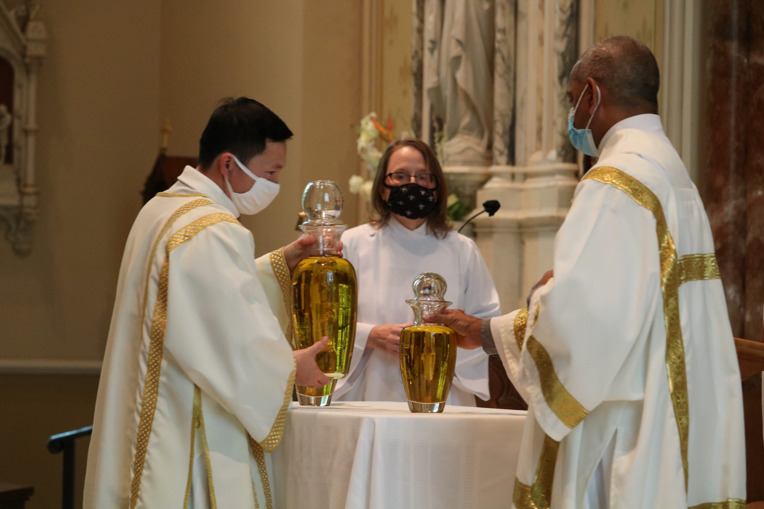 Masked, distanced priests take part in postponed chrism Mass ...